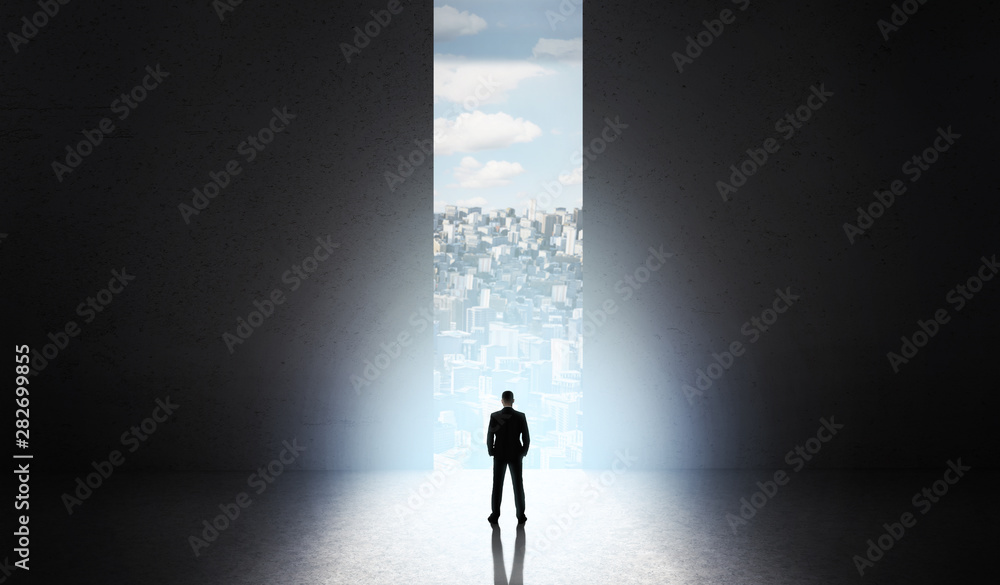 Man shadow on start new city building in front of big doors Stock Photo ...