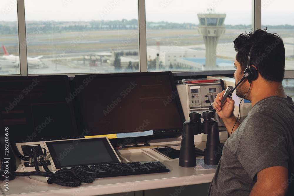 flight controller working in the flight control tower. Stock Photo ...