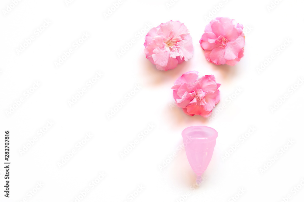 Menstrual cup and flowers isolated on white background. Eco-friendly ...