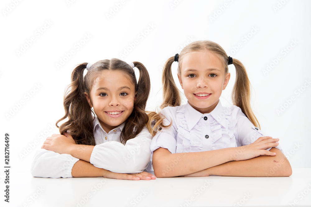 First grade. Schoolgirls sit desk white background. Schoolgirls ...
