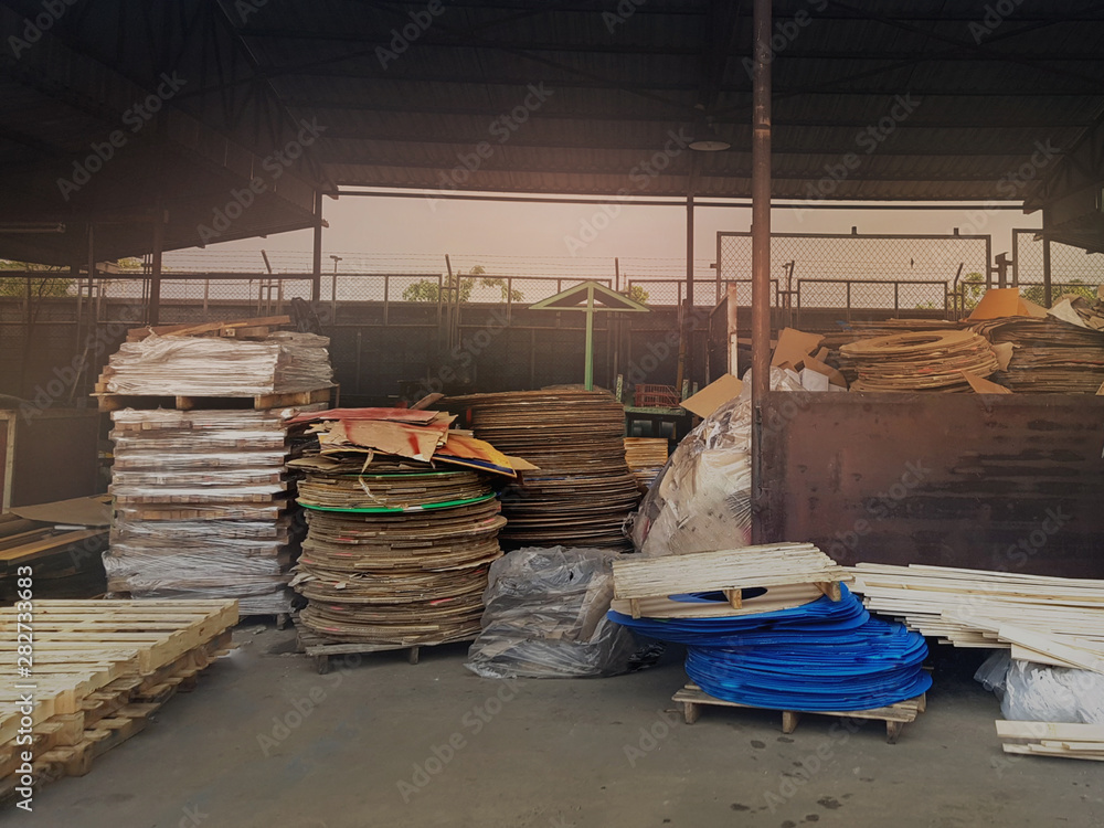 Collected area of used scrap cardboard paper and wood pallets from ...