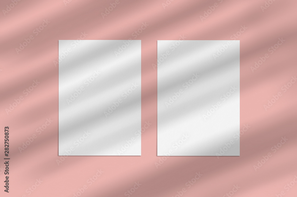 Blank white vertical paper sheet 5x7 inches on light coral background ...