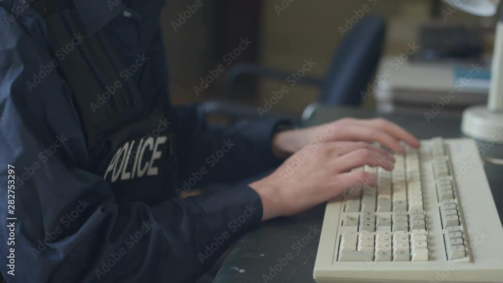 Police officer in precinct solving crimes Stock Video | Adobe Stock