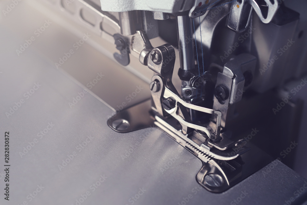Mechanism of an industrial overlock sewing machine - closeup view in ...