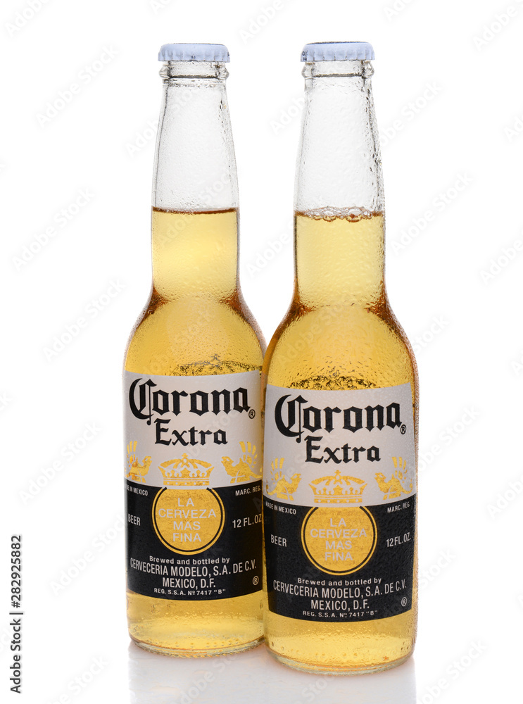 IRVINE, CA - MAY 27, 2014: Two bottles of Corona Extra Beer on a bed of ...
