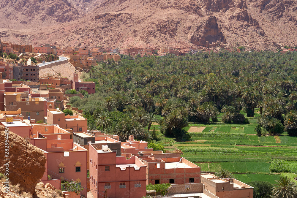 Landscape with an ancient town Tinghir, a beautiful lush Green Oasis ...