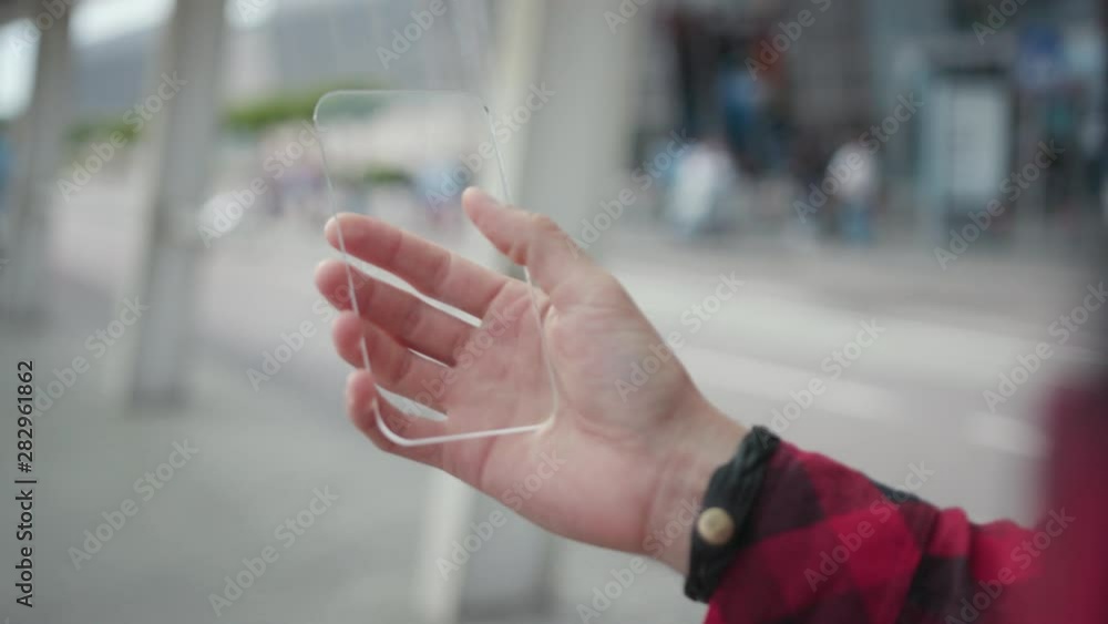 Vidéo Stock Close up hands man holding futuristic transparent ...