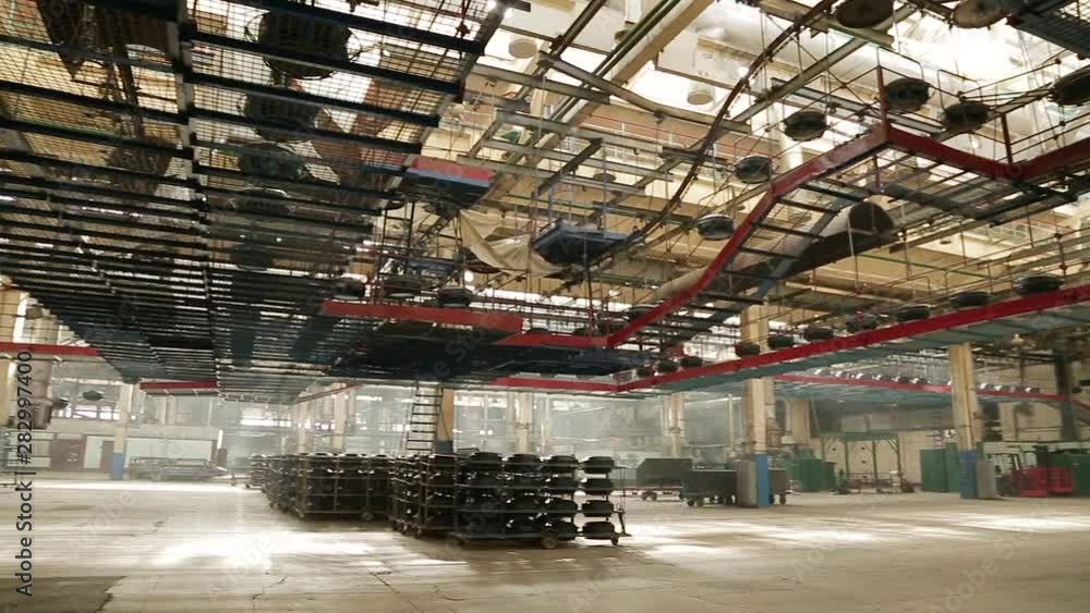 Tire blanks are stacked in the workshop. Conveyor with tires at factory ...