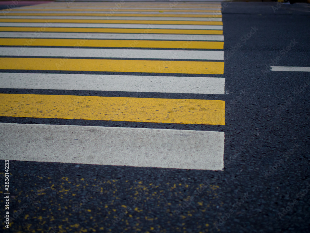 Pedestrian crossing with white and yellow lines crosswalk Stock Photo ...