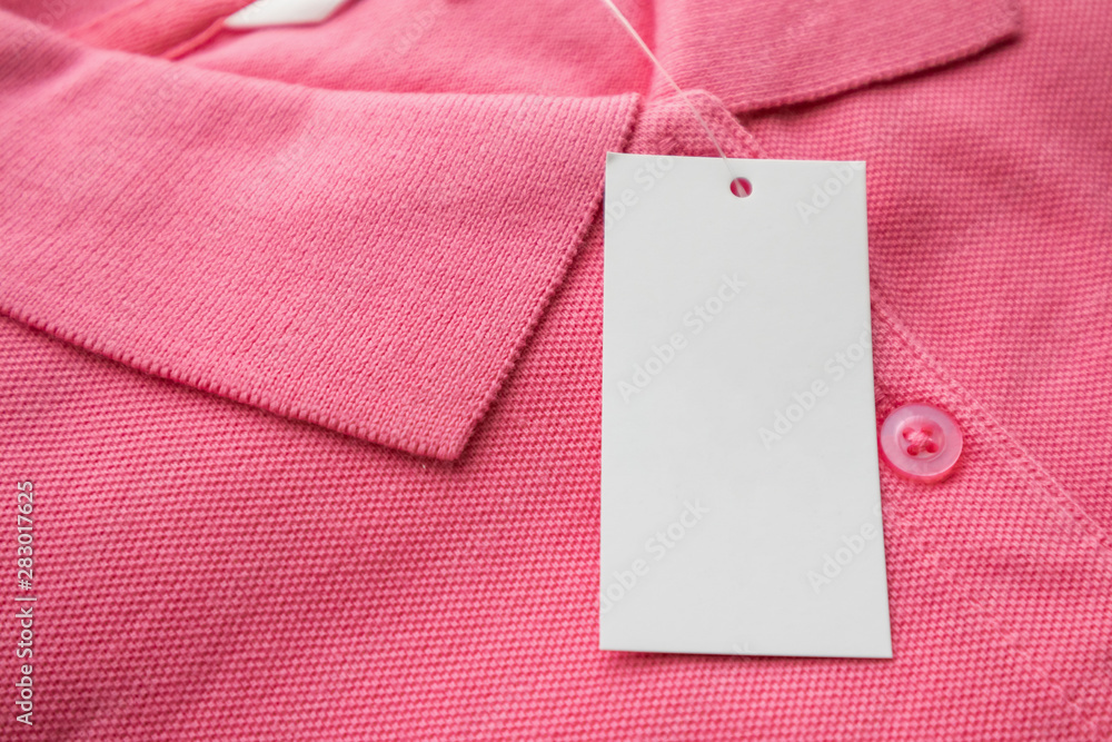 Blank white clothes tag label on new shirt Stock Photo | Adobe Stock