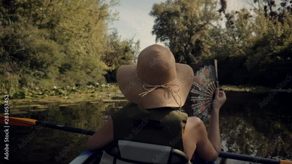 Girl Swimming On Kayak And Using Chinese Fan In Slow Motion.Tourist ...