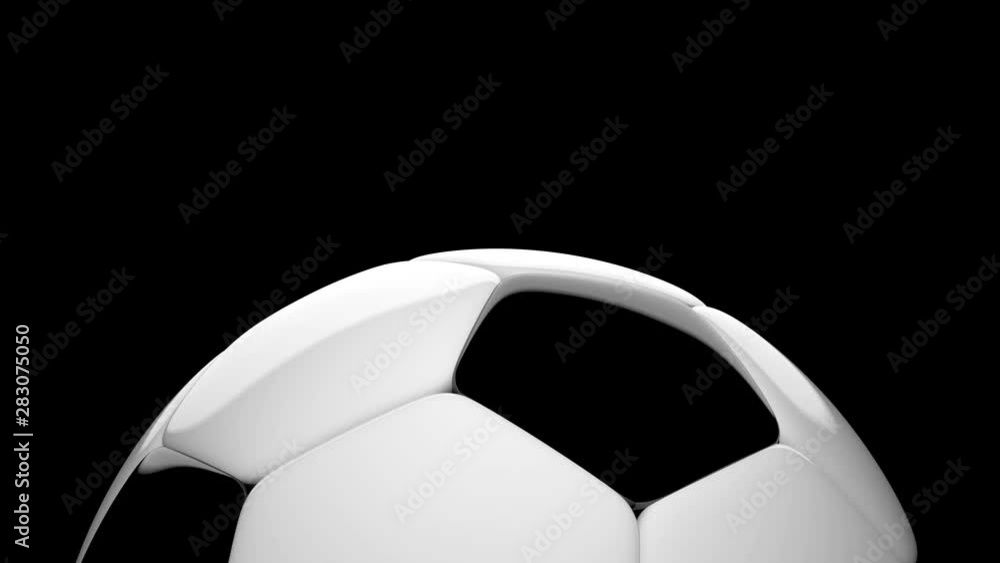 Soccer ball rotation on a black background with a change of lighting ...