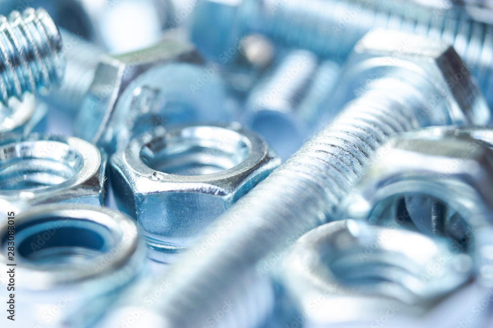 Metal bolts and nuts in a row background. Chromed screw bolts and nuts ...