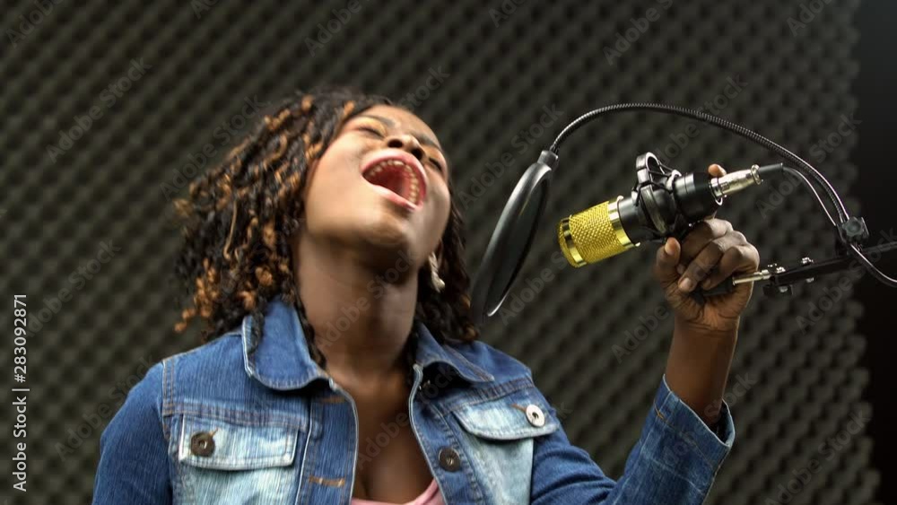 African american alfro hair black Woman sing a song loudly and express ...