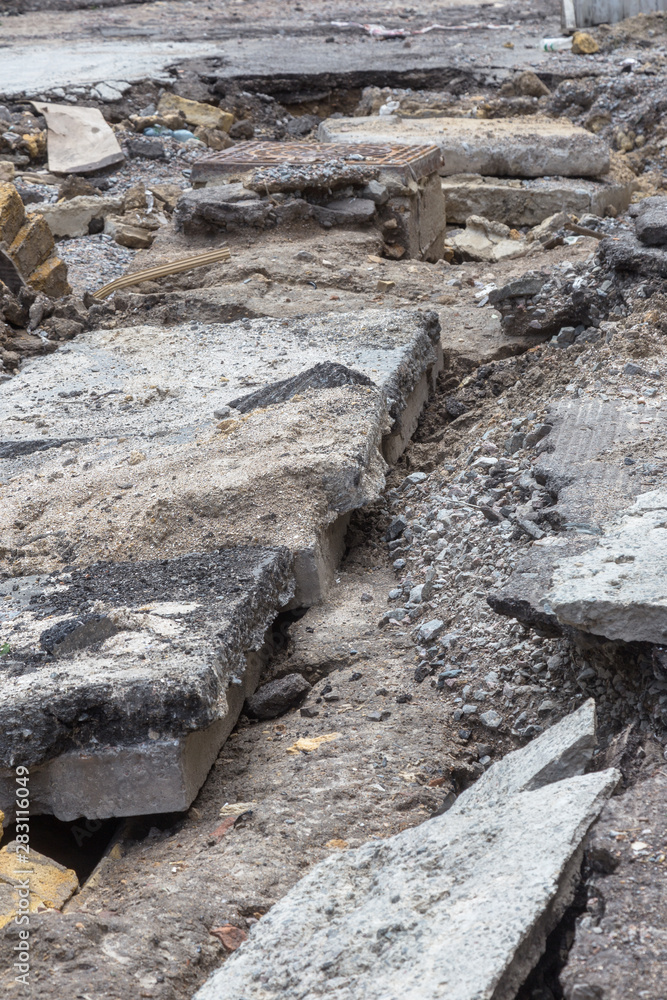 Large cracks, chips. Broken asphalt shifted landslide after flood ...