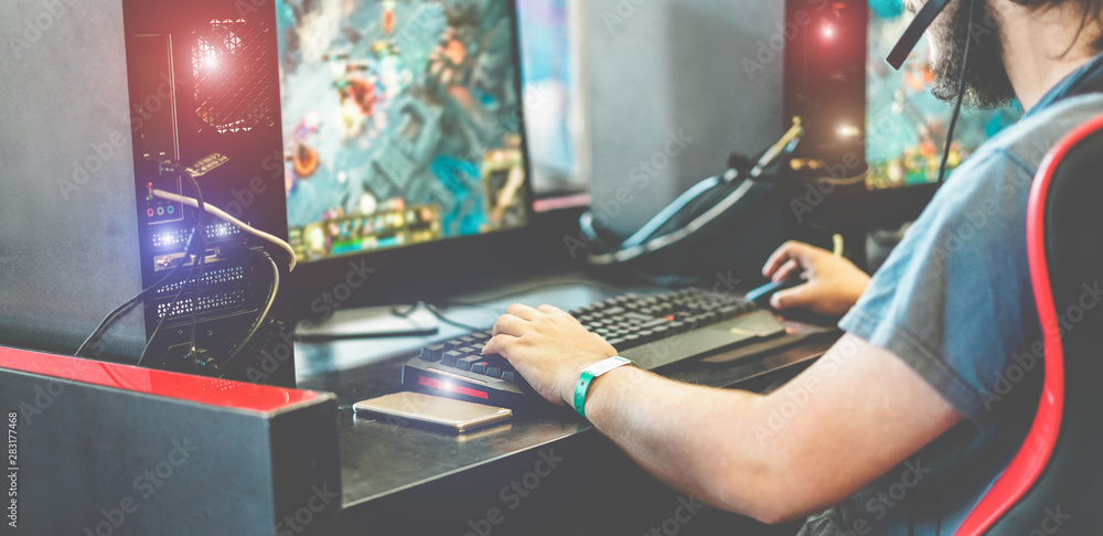 Young streamer gamer playing at e-sports competition - Male guy having ...