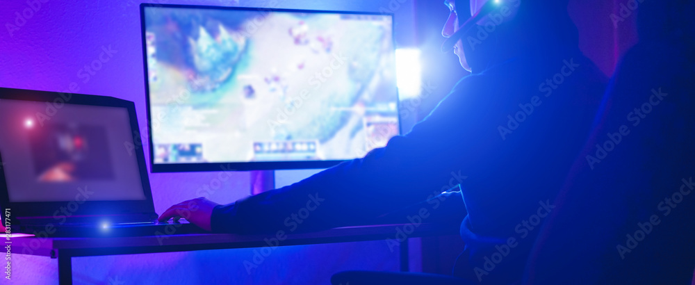 Young streamer gamer playing at strategy game in broadcast browser ...