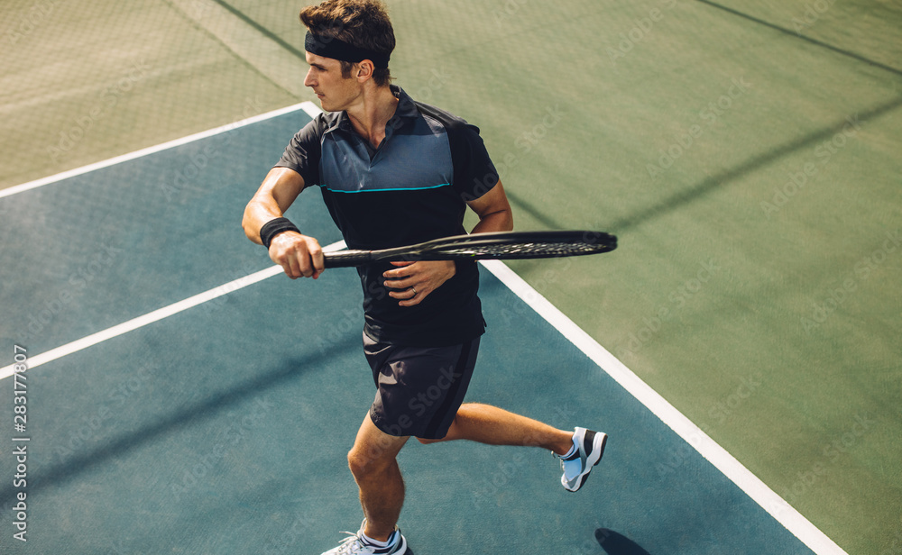 Tennis player hitting a forehand in game Stock-Foto | Adobe Stock