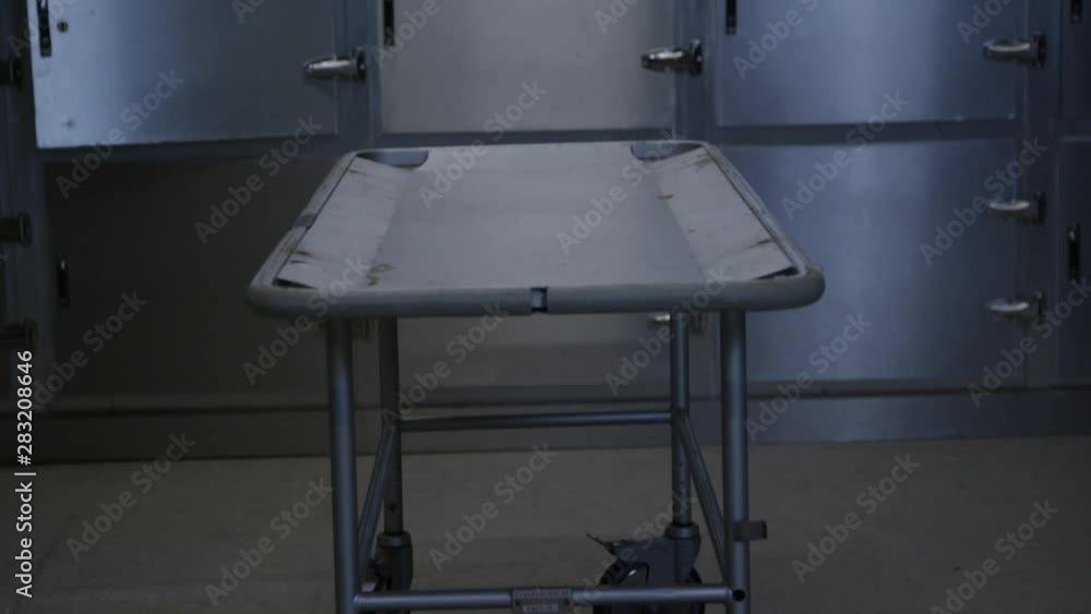 Scene in a modern morgue - body on gurney Stock Video | Adobe Stock