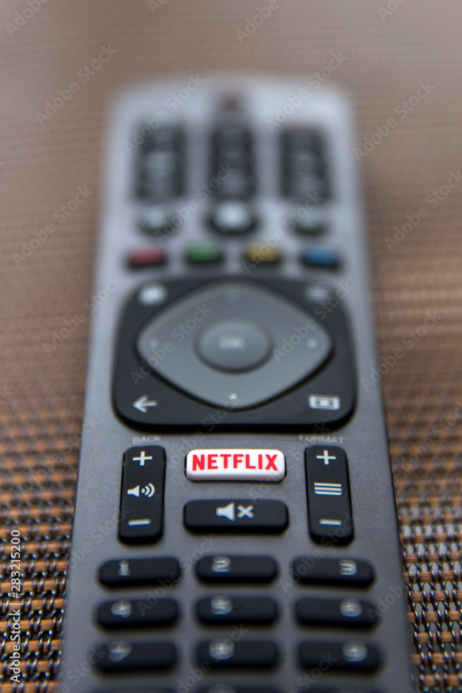 Close up Netflix remote control. Netflix is an American media-services ...