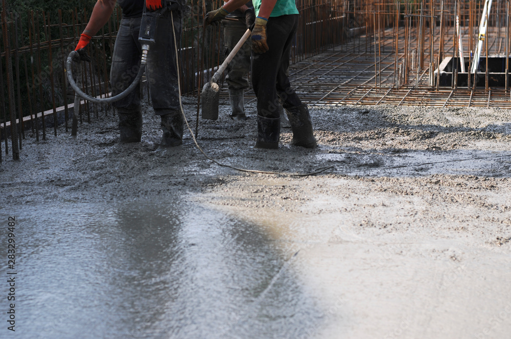 Concrete pouring during commercial concreting floors of buildings in ...