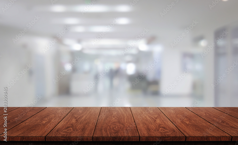Wood table in modern hospital interior with empty copy space on the ...