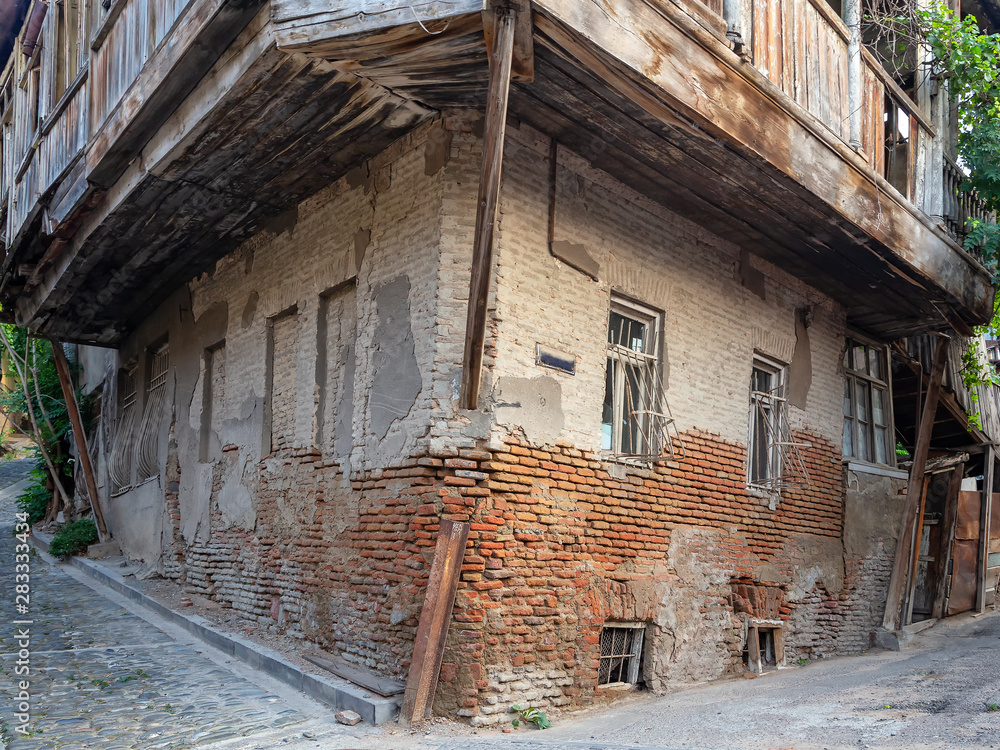 Old rickety brick house Stock Photo | Adobe Stock