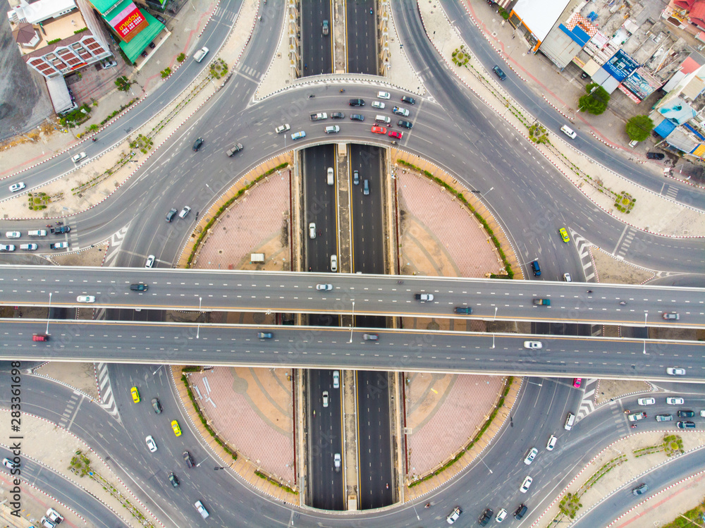 Aerial top view circular junction city transport road with car movement ...