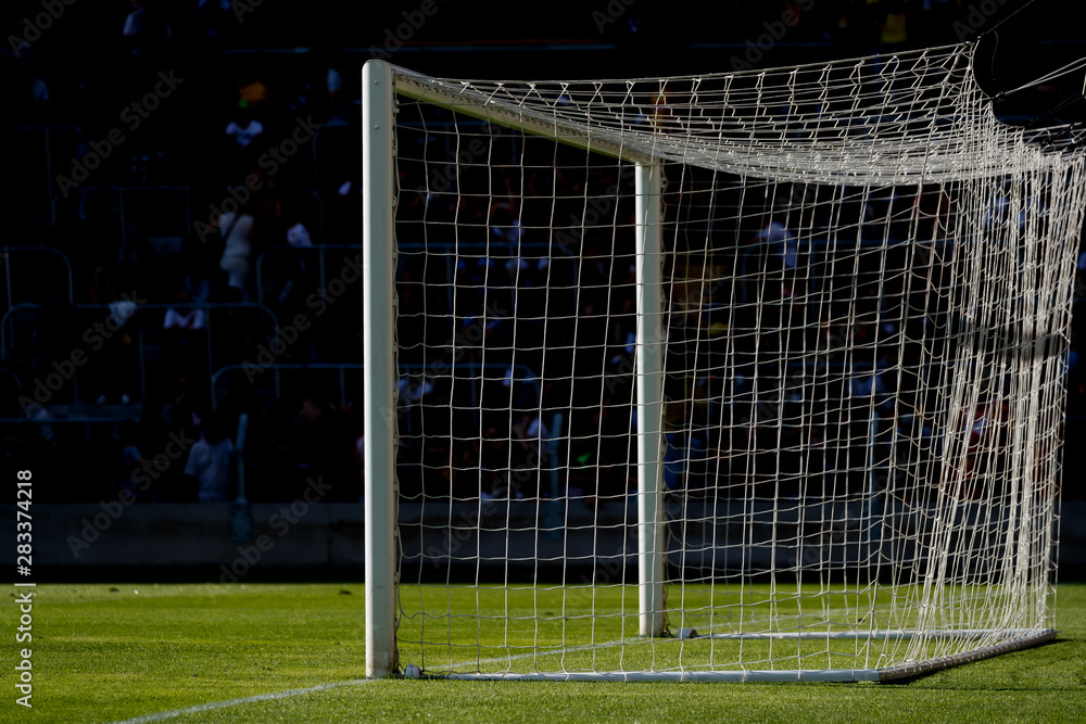 Soccer and football goal cage with black background Stock Photo | Adobe ...
