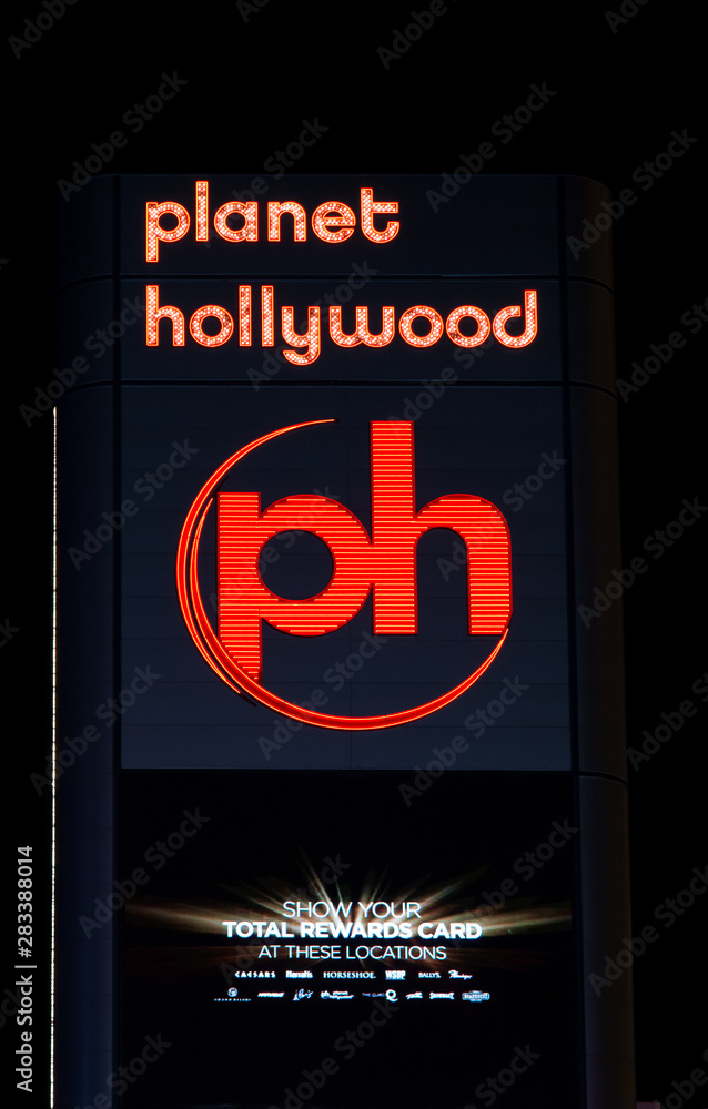 Planet Hollywood Sign and Logo at Night Stock Photo | Adobe Stock