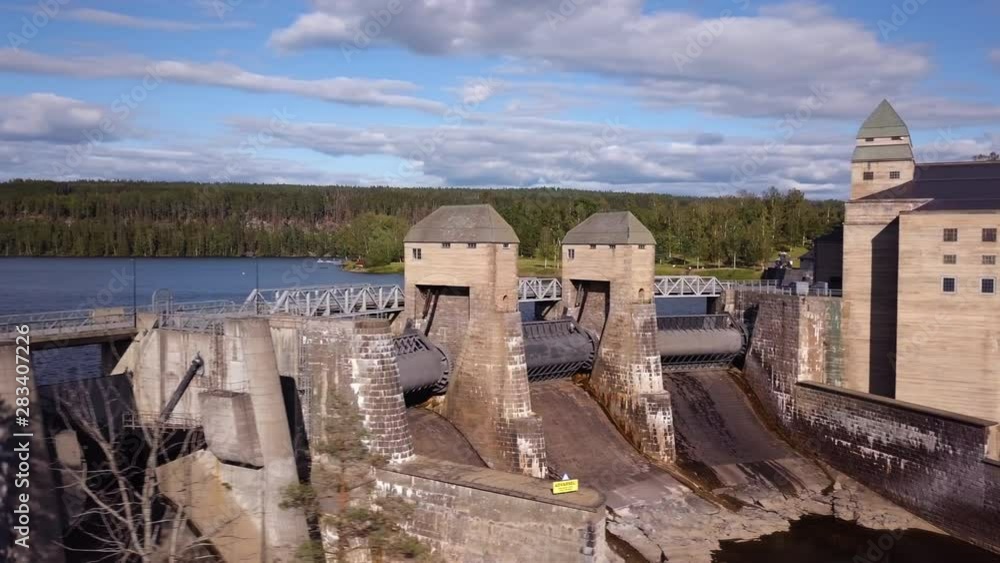 Aerial, pan, drone shot, of closed gates, at the Solbersfossen ...