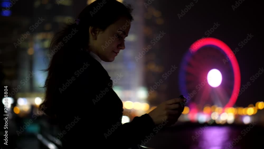 Vidéo Stock Woman browse photographs on smartphone, stay at Hong Kong ...