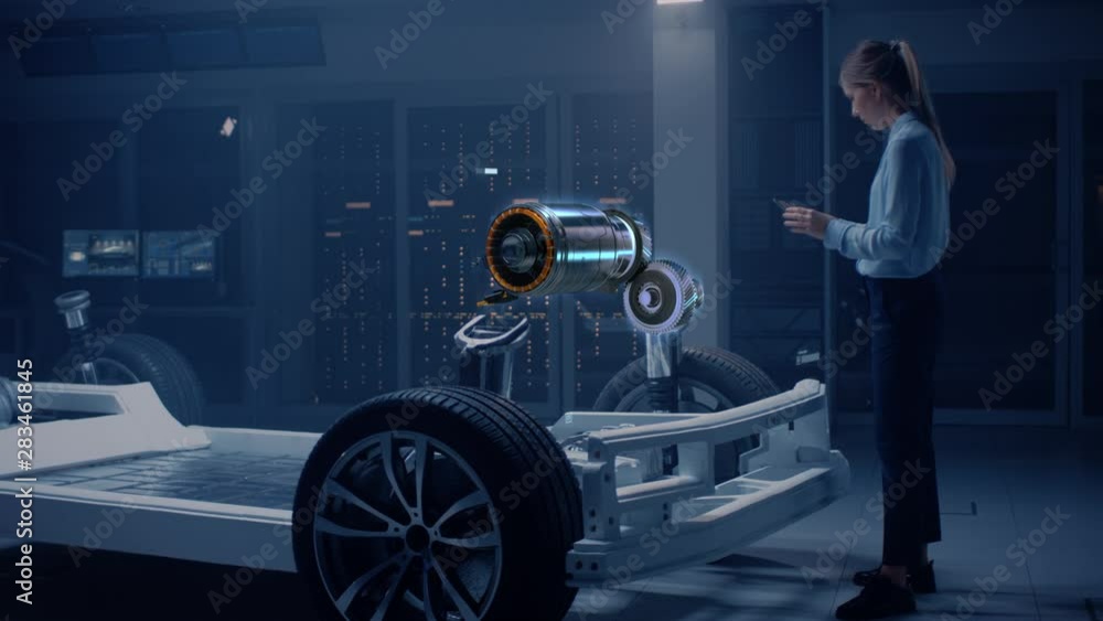 Female Automobile Engineer Using Digital Tablet with Augmented Reality ...