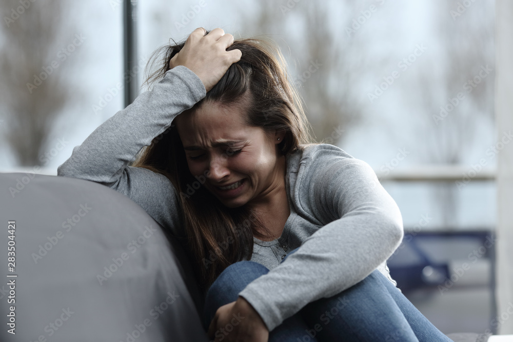 Sad girl complaining and crying at home Stock Photo | Adobe Stock Sad girl complaining and crying at home Stock Photo | Adobe Stock