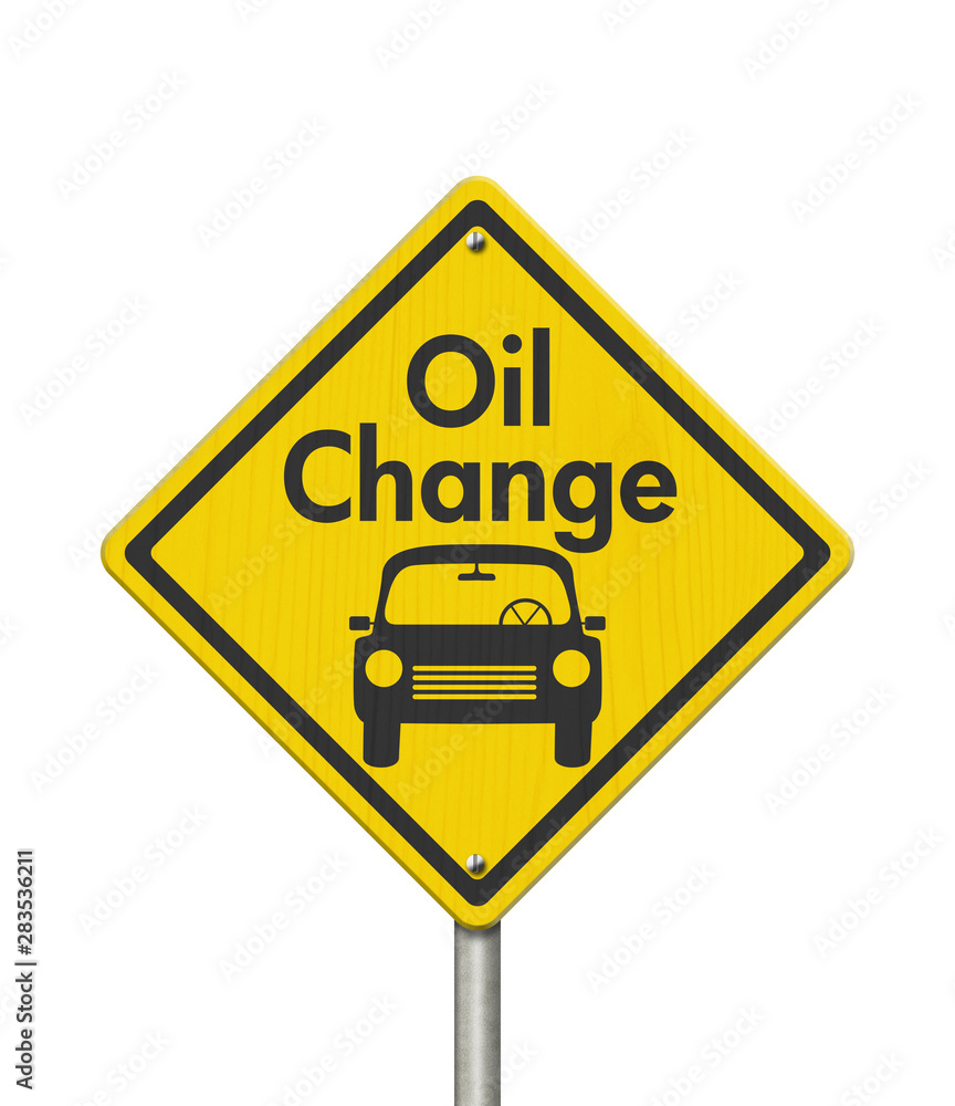 Oil change with car on yellow warning highway road sign Stock Photo ...