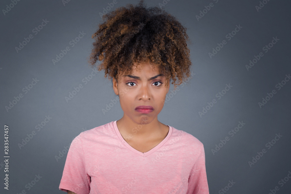 Beautiful face of sad African woman crying desperate and depressed with ...