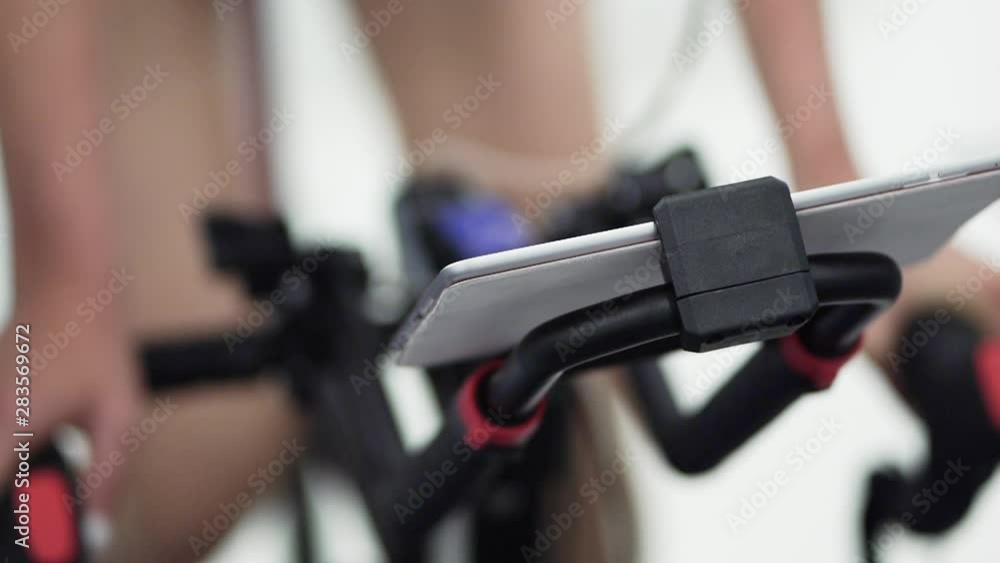 Sport medicine research. Athlete doing testing by cycling in modern ...