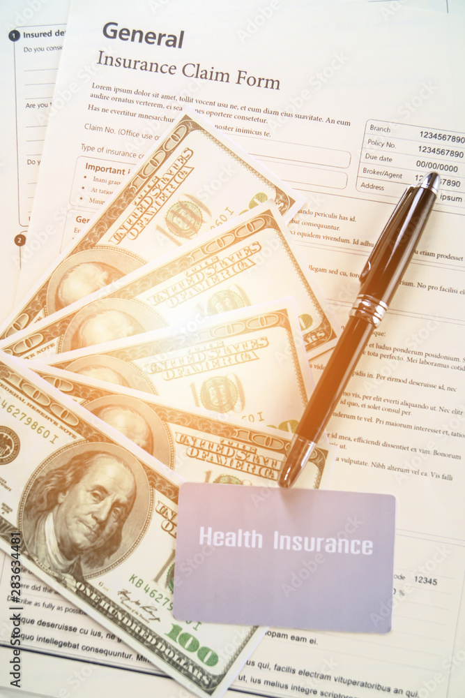 health insurance card and bank note and pen on background of general ...