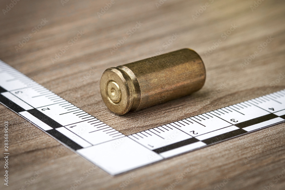 Crime Scene Investigation - bullet casing as a piece of evidence placed ...