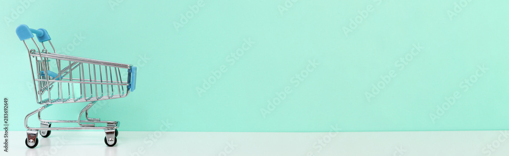 Empty shopping cart banner on light blue background Stock Photo | Adobe ...