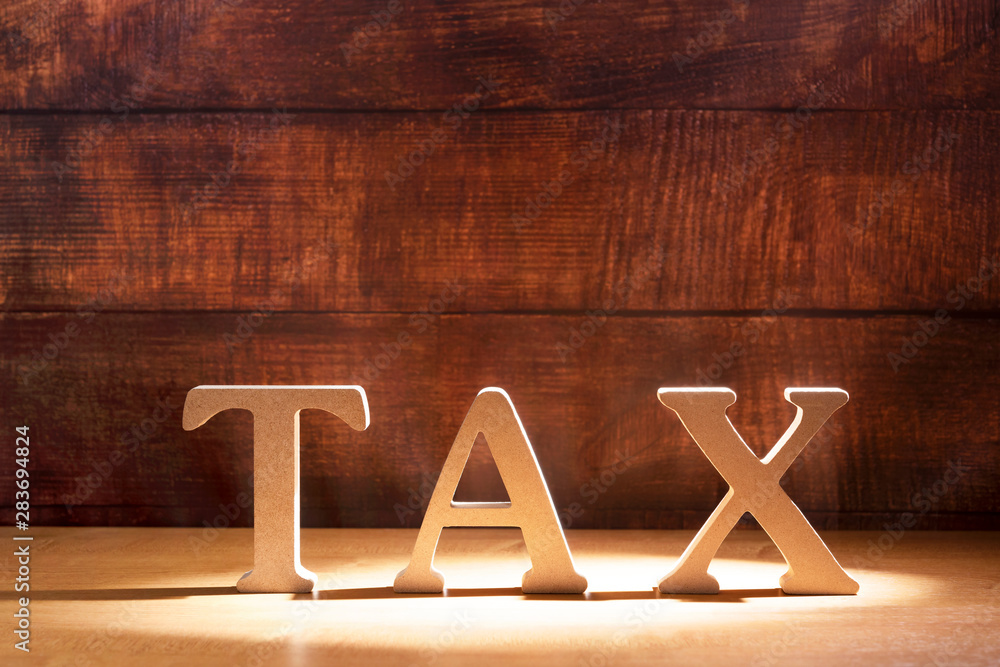 Tax concept on woody background. 税金 Stock Photo | Adobe Stock