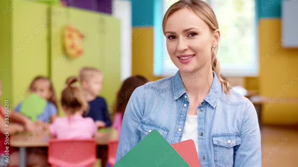 Smiling female teacher in the preschool Stock Video | Adobe Stock