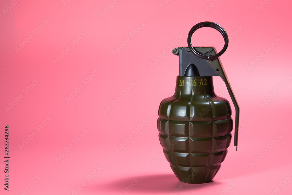 Green metal hand Grenade with round pin over When I pull out it will ...