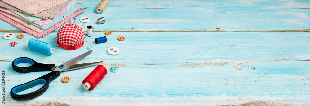 Handmade and sewing background. Cotton fabric, sewing accessories for ...