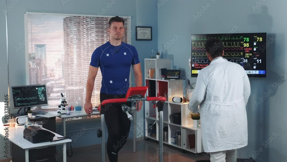 Scientific sports laboratory: doctor coming to monitor athlete's stress ...