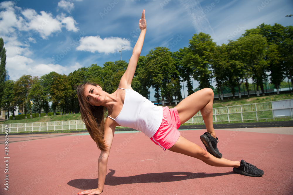 Stretching exercises. Training outdoors. Woman healthy body practice ...