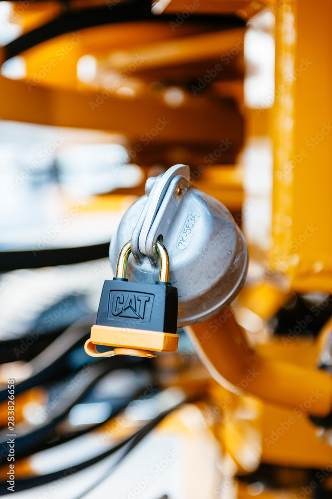 PARIS, FRANCE - SEP 5, 2014: Powerful secure metallic lock with the CAT ...