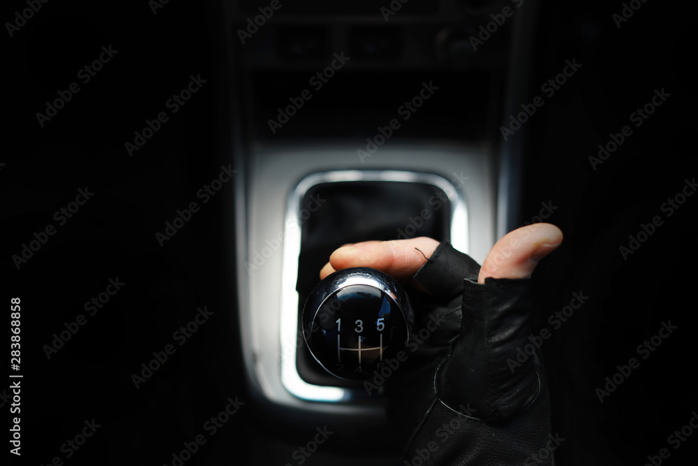 Gear lever. Manual Transmission. Hand on the gear shift in a car. Stock ...