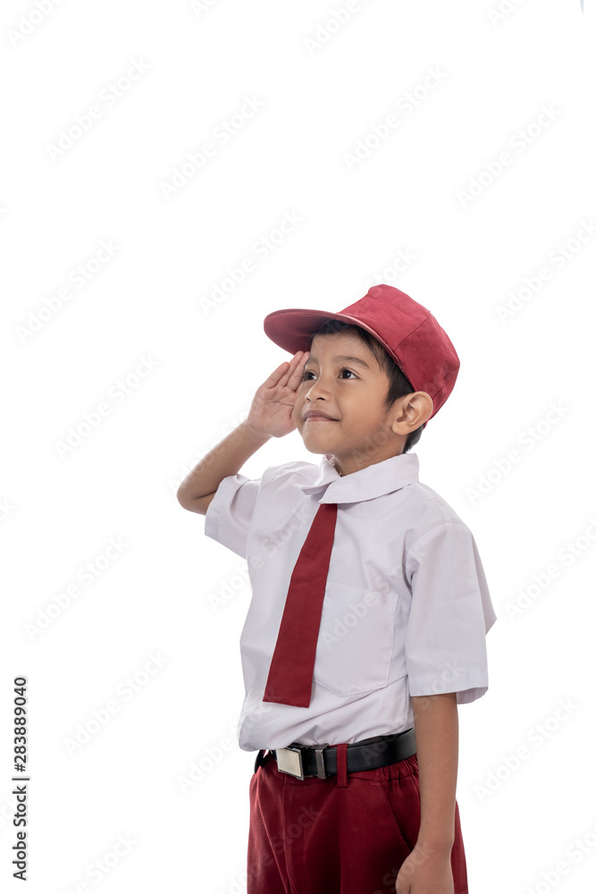 indonesian elementary student wearing uniform giving salute while ...