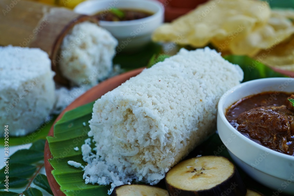 Kerala breakfast rice Puttu /Pittu made in bamboo mould served with ...